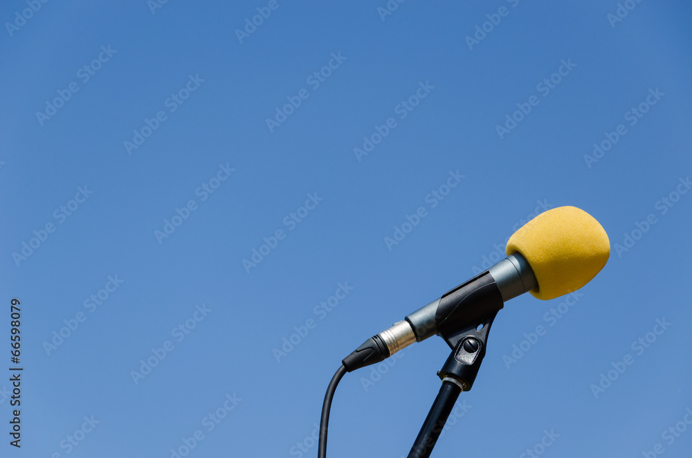 yellow microphone blue sky bakcground Stock Photo | Adobe Stock