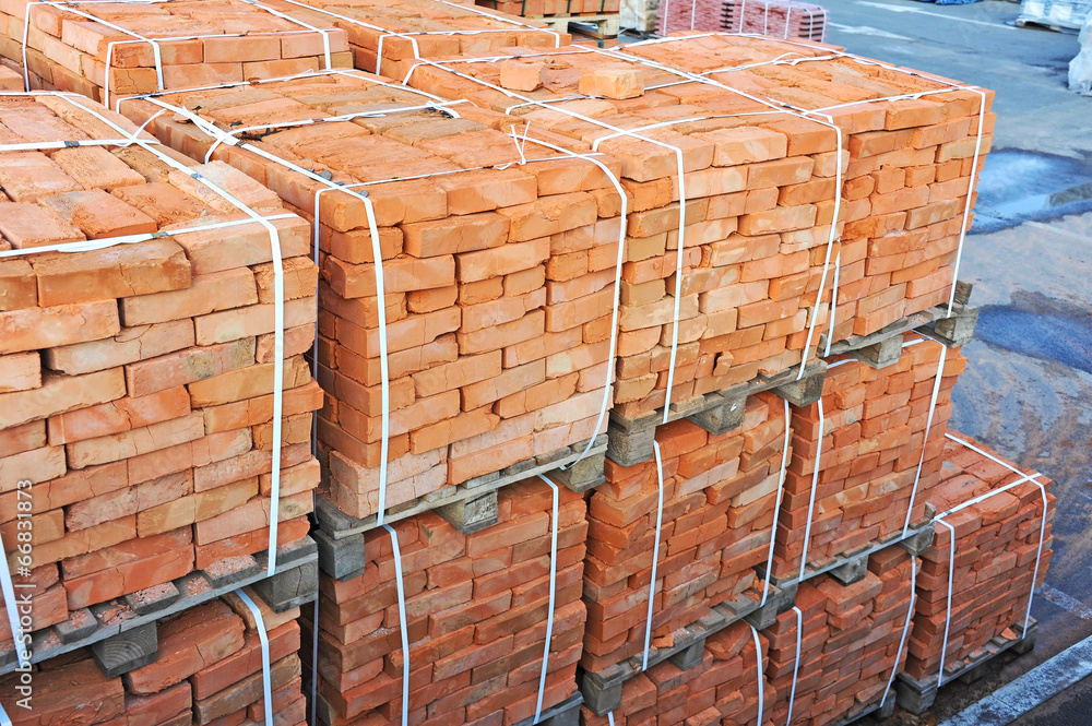 Stack of orange clay brick on construction site Stock Photo | Adobe Stock