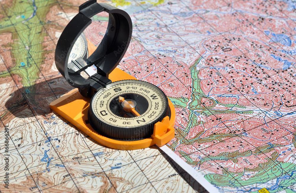 Compass and maps. Stock Photo | Adobe Stock