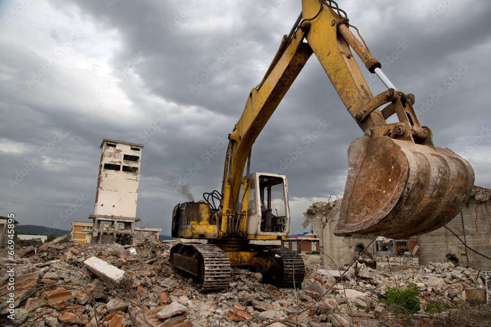 Bulldozer removes the debris from demolition of old buildings Stock ...