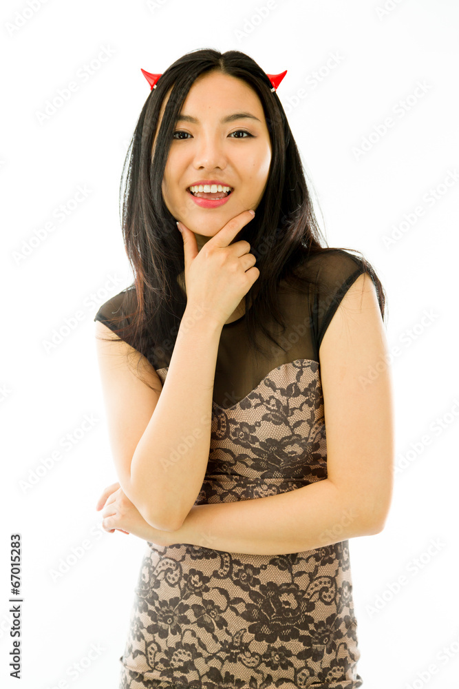 Asian young woman dressed up as a devil and smiling isolated on Stock ...