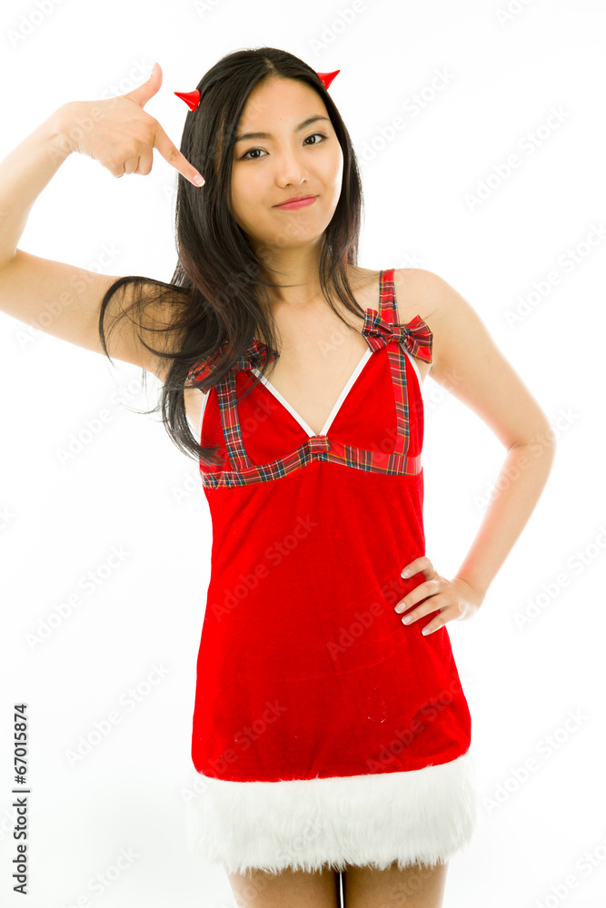 Devil side of a young Asian woman pointing and smiling isolated Stock ...
