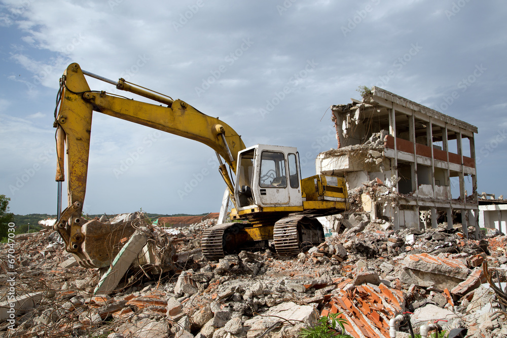 Bulldozer removes the debris from demolition of old buildings Stock ...