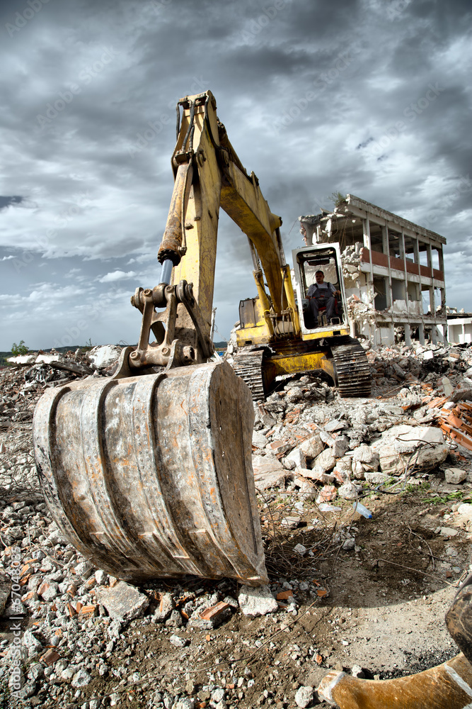 Bulldozer removes the debris from demolition of old buildings Stock ...