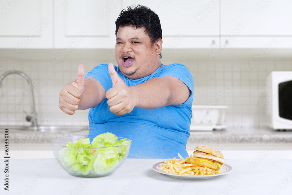 Man showing healthy and unhealthy food 2 Stock Photo | Adobe Stock
