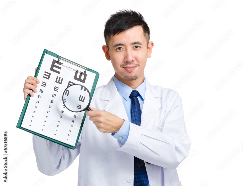Doctor hold with eye chart and magnifying glass Stock Photo | Adobe Stock