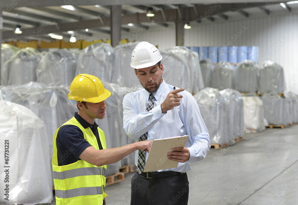 Teamwork - Manager and workmen of a logistics company Stock Photo ...