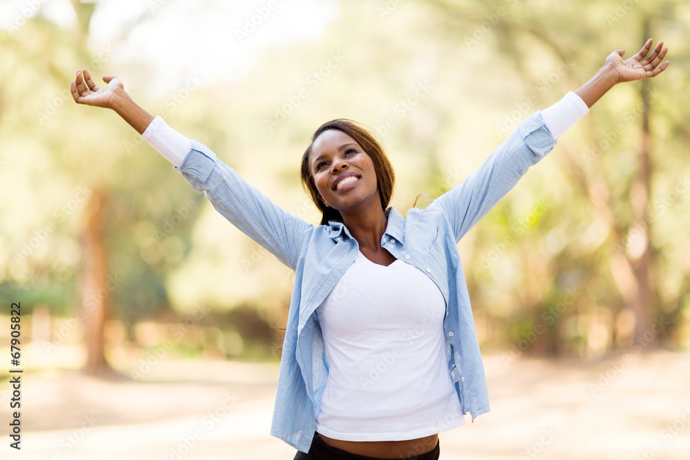 african woman with arms outstretched Stock Photo | Adobe Stock