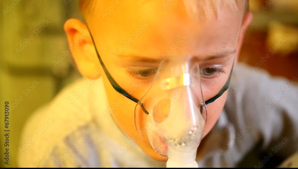 boy makes inhalation from cough and runny nose at home Stock-Video ...