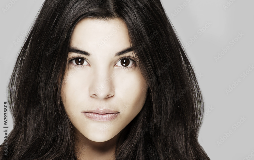 Beautiful young woman's face long hair Stock Photo | Adobe Stock