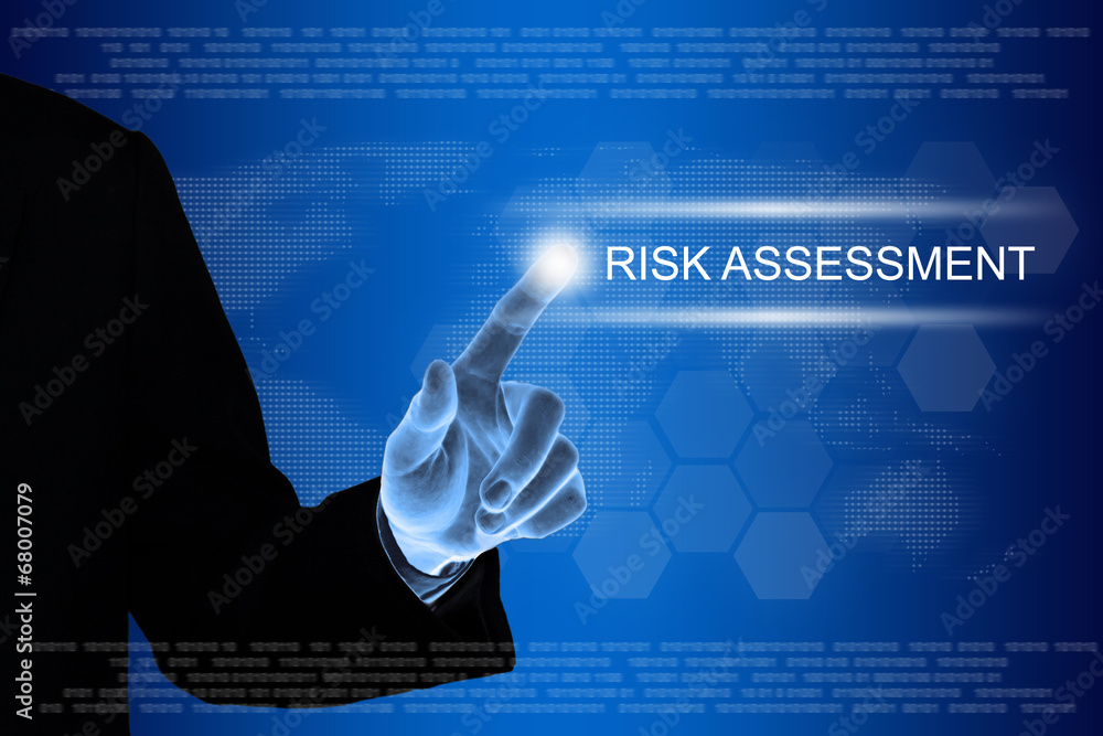 business hand clicking risk assessment button on touch screen Stock ...