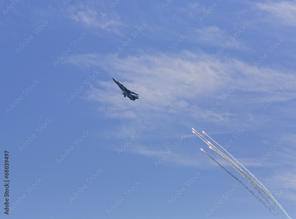 Russian jet fighter launches anti-missile flares Stock Photo | Adobe Stock