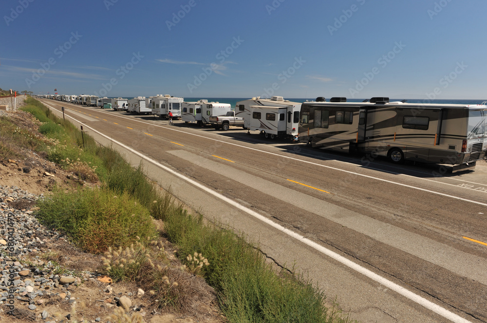 Row of recreational vehicles parked on road Stock Photo | Adobe Stock