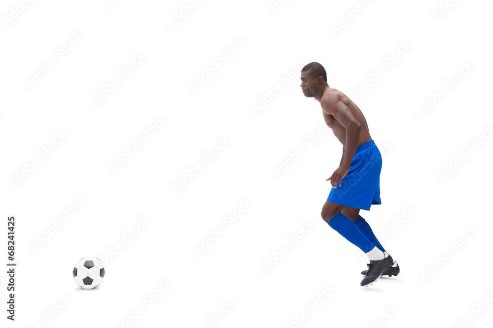 Shirtless football player moving to the ball Stock Photo | Adobe Stock