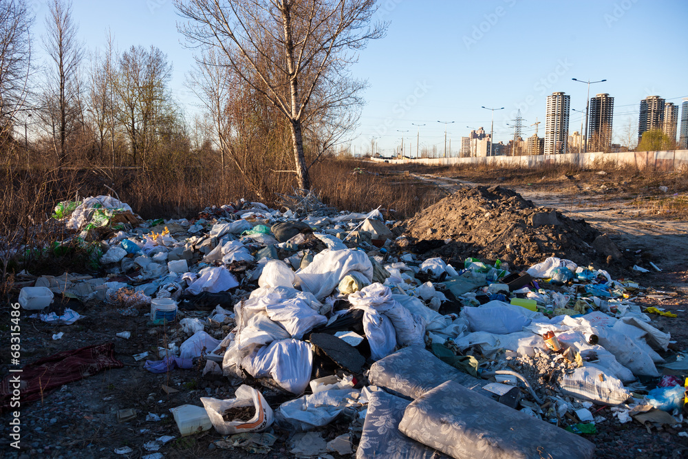 Garbage on the landfill near high-rise buildings of the city Stock ...