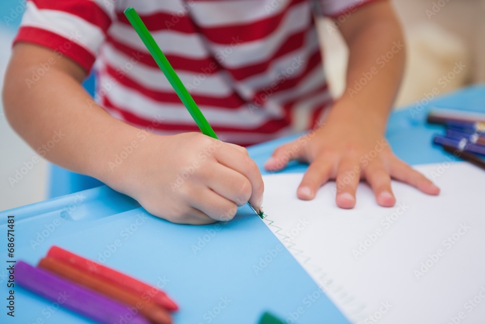 Cute little boy drawing at desk Stock Photo | Adobe Stock