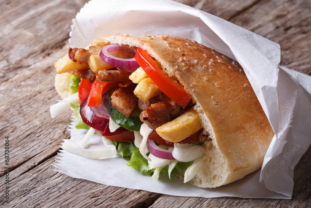 doner kebab with meat, fried potatoes and vegetables Stock Photo ...