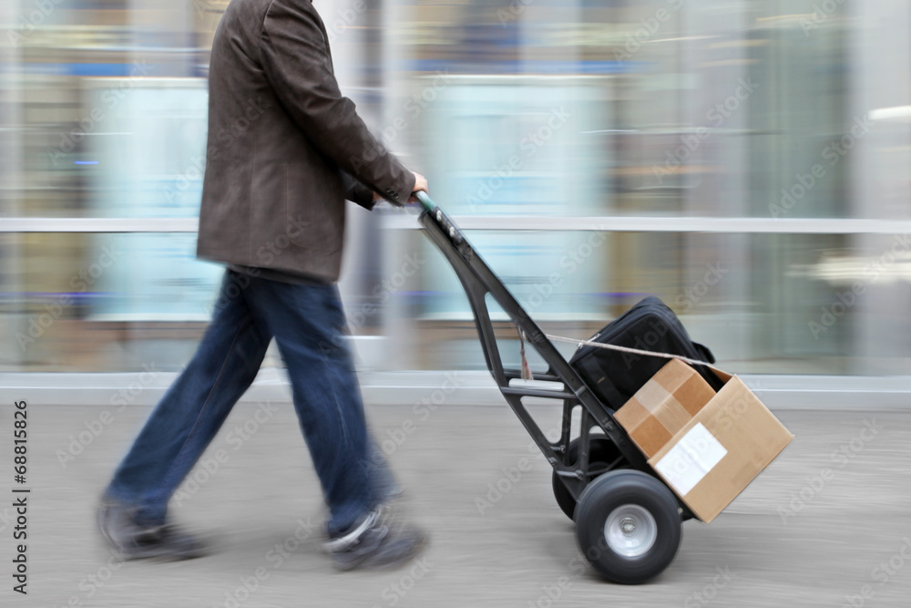 Foto Stock delivery with dolly by hand | Adobe Stock
