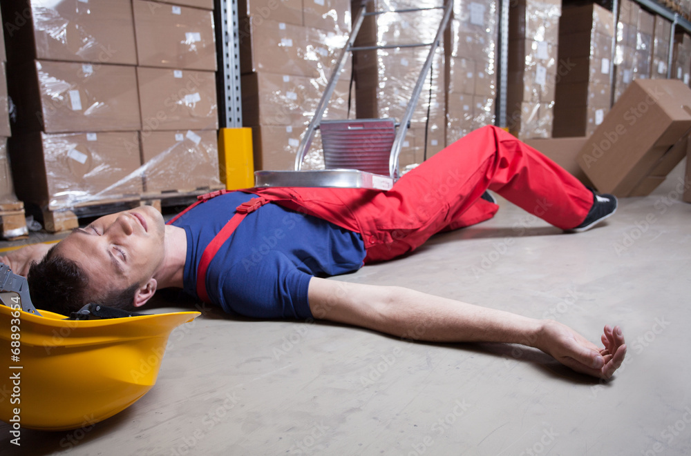 Unconscious worker after falling from a ladder Stock Photo | Adobe Stock