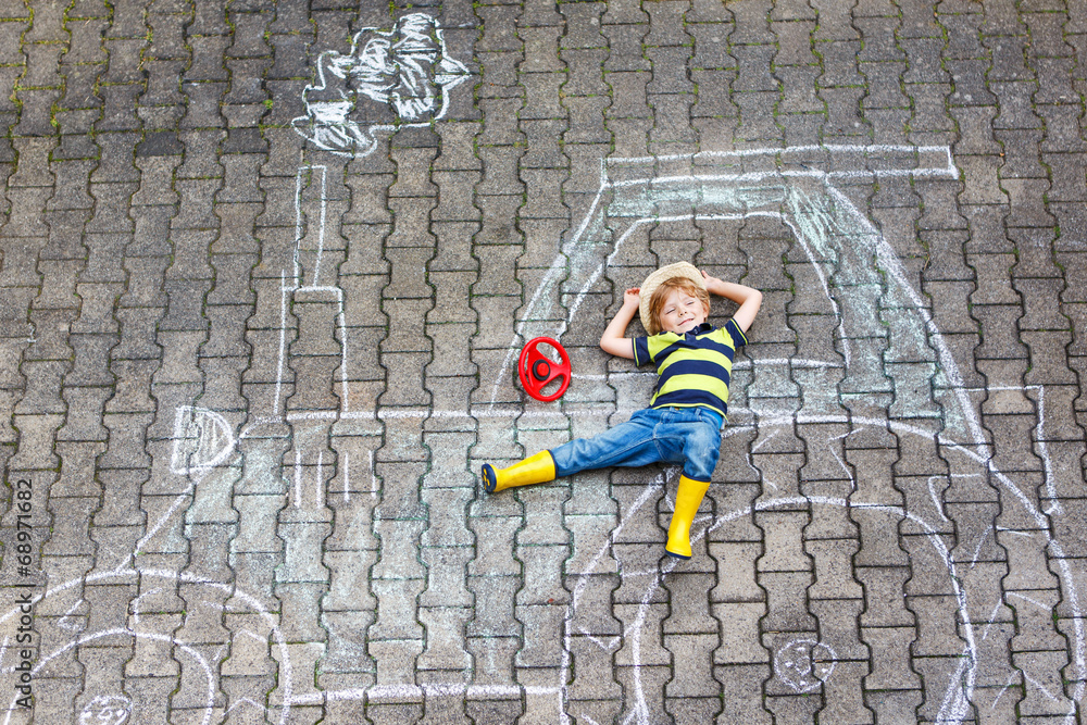 Little boy having fun with tractor picture drawing with chalk Stock ...