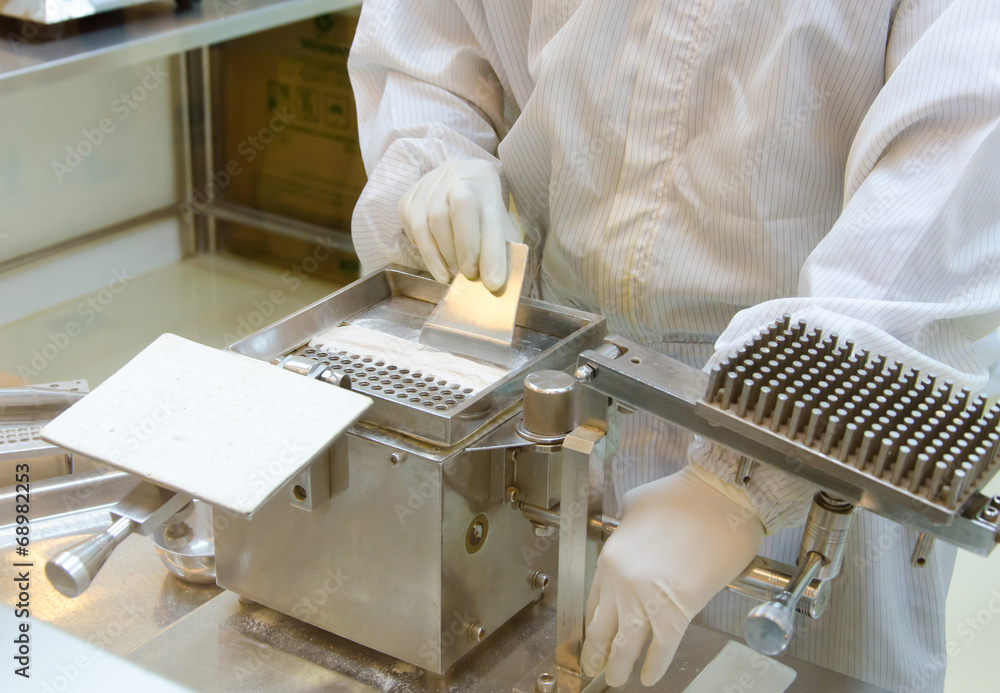 pharmacist preparing medication with packaging capsule Stock Photo ...