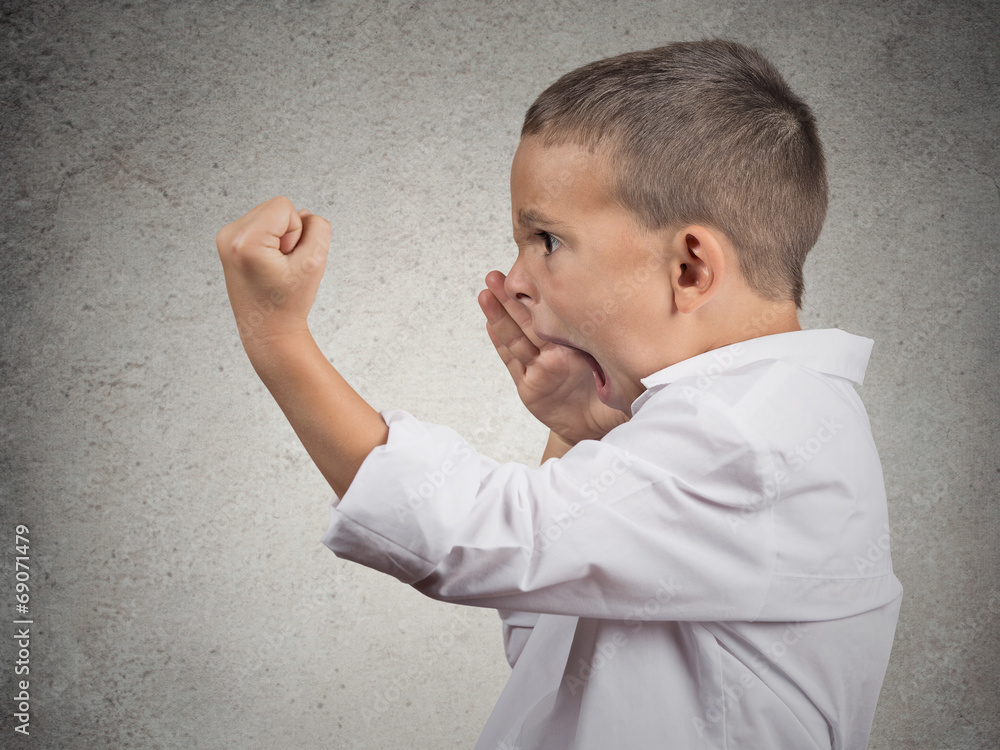 Angry Boy Screaming, side view portrait, grey wall background Stock ...