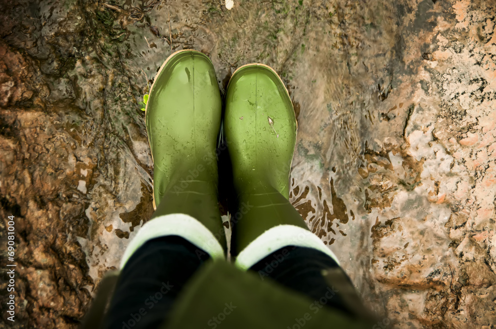 female feet wearing in gumboots. Stock Photo | Adobe Stock