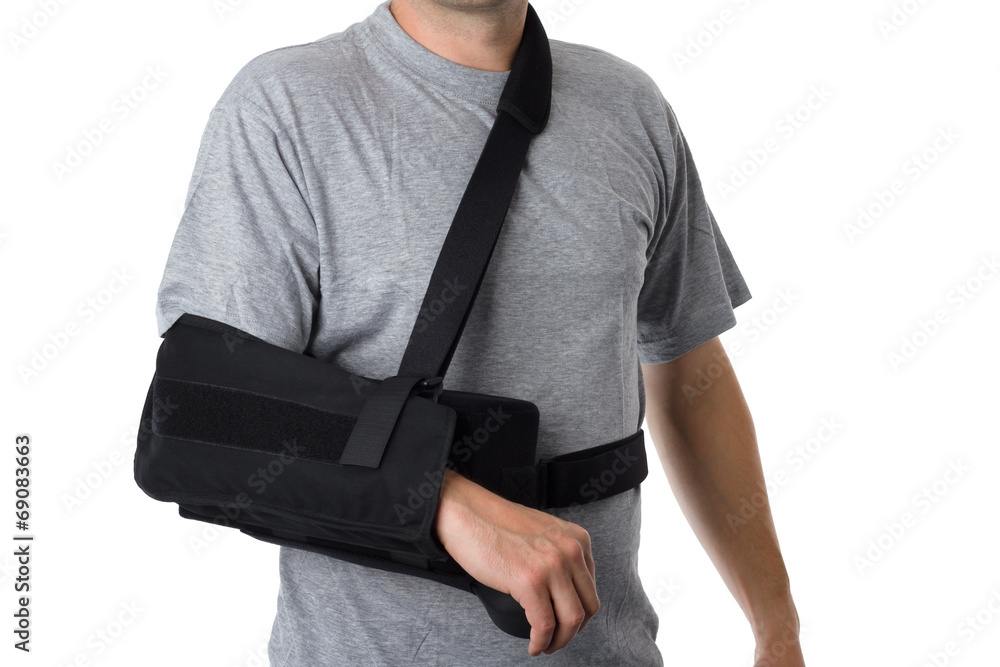 Man wearing an arm brace over white Stock Photo | Adobe Stock