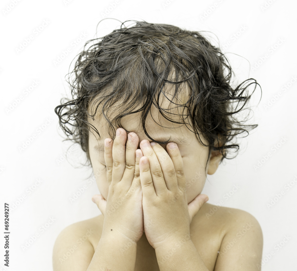 Closeup portrait of shy toddler girl covering her face Stock Photo ...