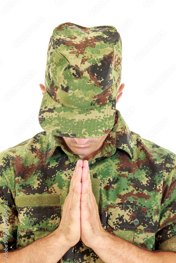 War soldier praying in military camouflage uniform with head bow Stock ...