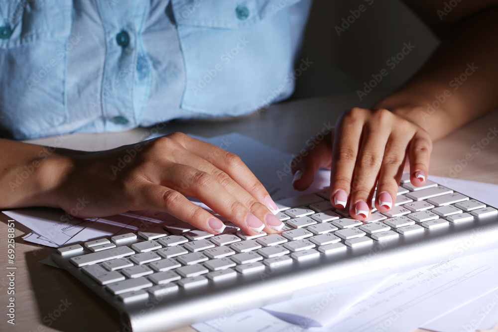Female hands typing on keyboard, close-up, on dark background Stock ...