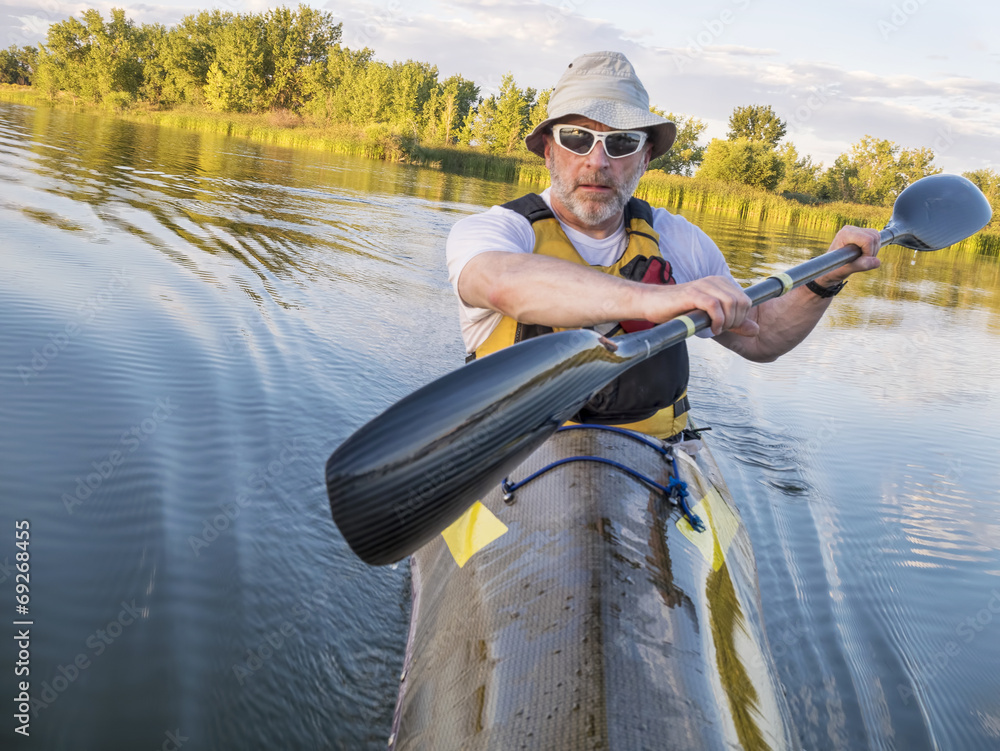 paddling fast sea kayak Stock Photo | Adobe Stock