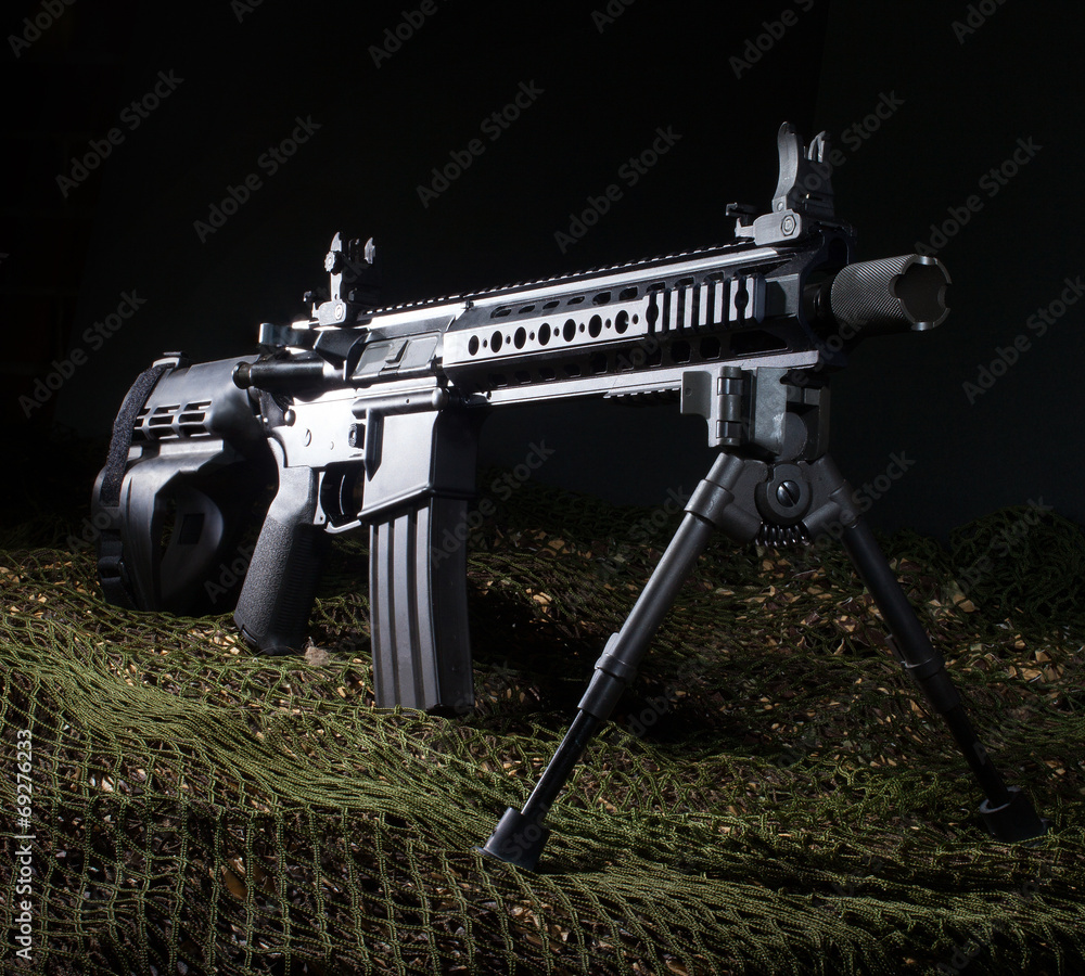 AR-15 pistol on green netting with a dark background Stock Photo ...