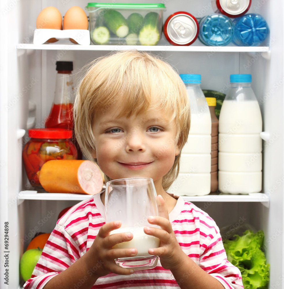 Happy little boy with food Stock-Foto | Adobe Stock