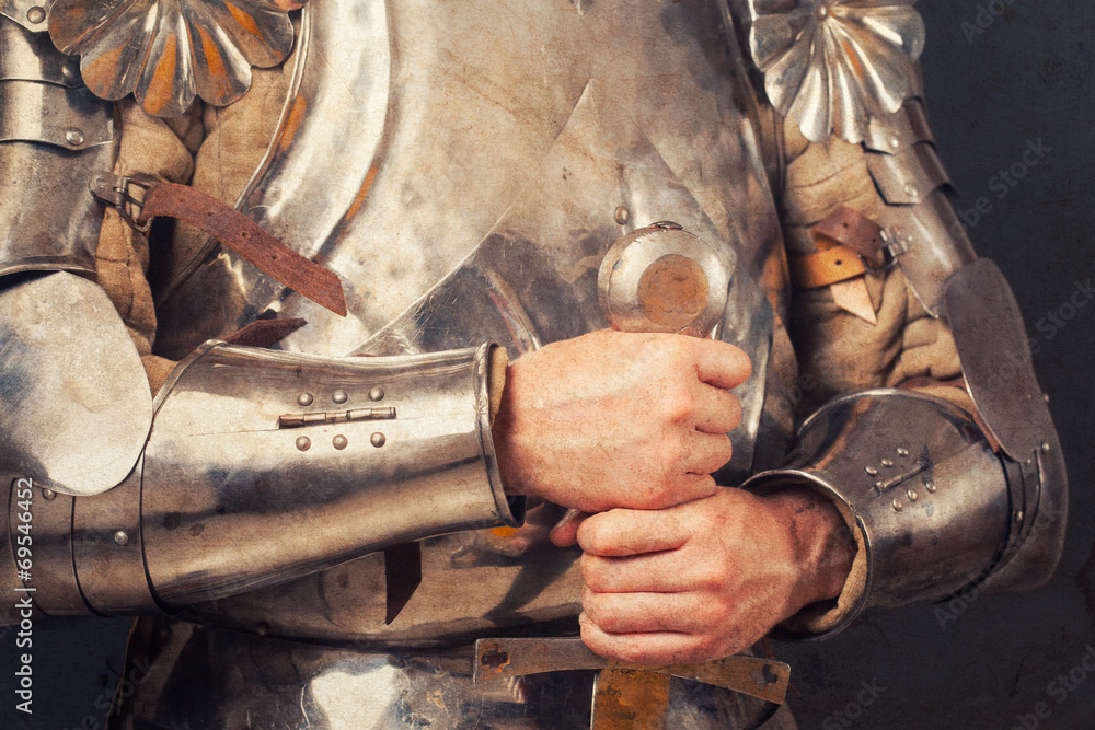 knight wearing armor and holding two-handed sword Stock Photo | Adobe Stock