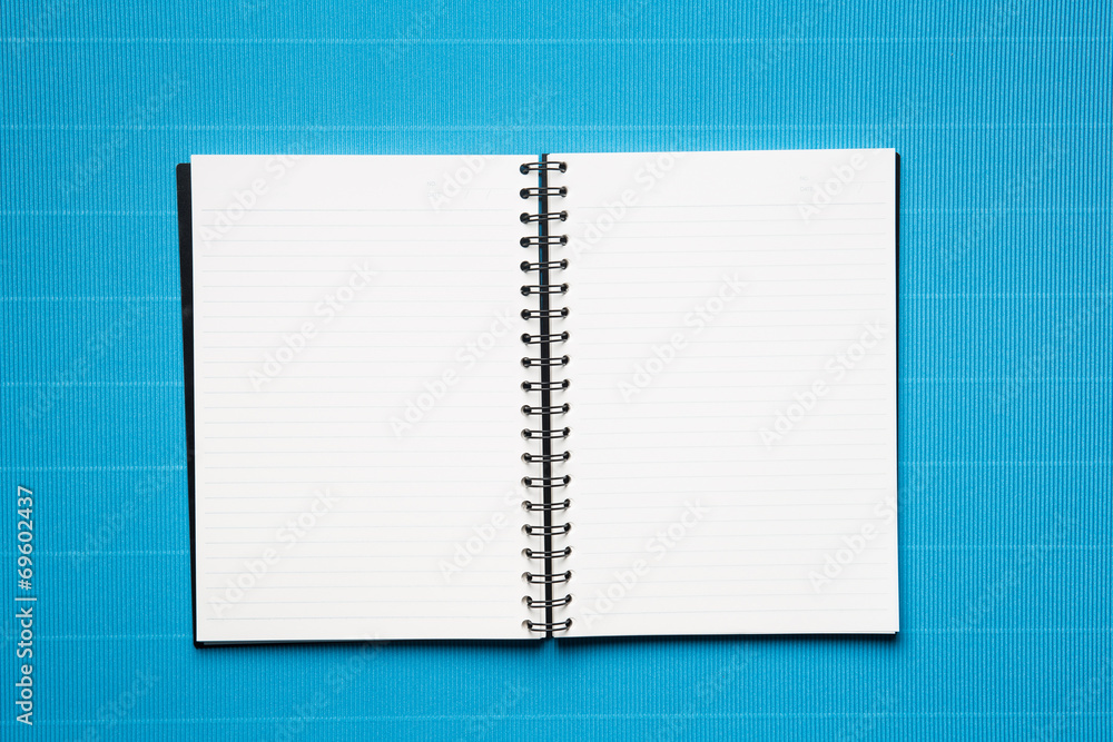 Foto de Open book with lines on a blue crepe paper background do Stock ...