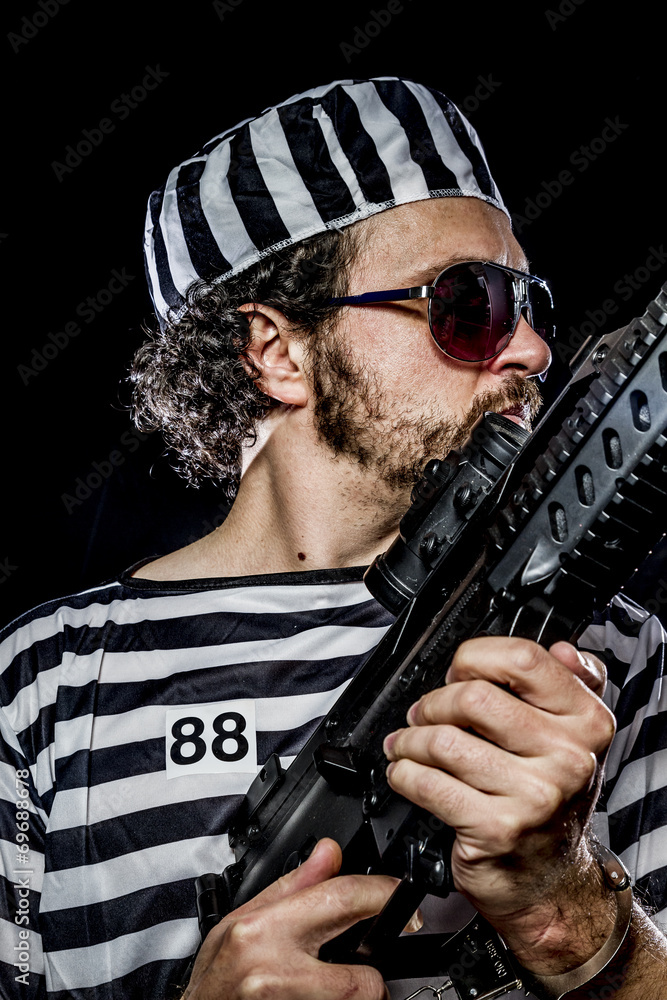 Security.Prison riot concept. Man holding a machine gun, prisone Stock ...