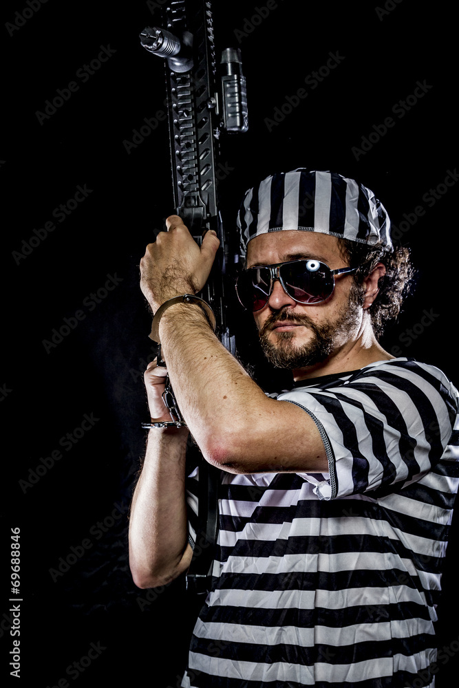 Security.Prison riot concept. Man holding a machine gun, prisone Stock ...
