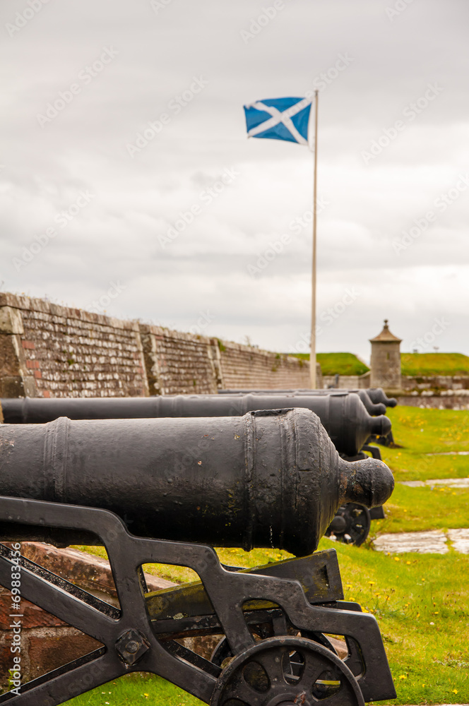 scottish flag next to cannons at fort george Stock Photo | Adobe Stock