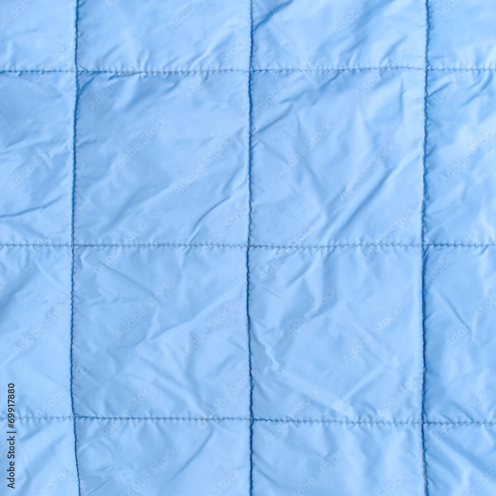 blue silk quilted fabric as a background, closeup Stock Photo | Adobe Stock