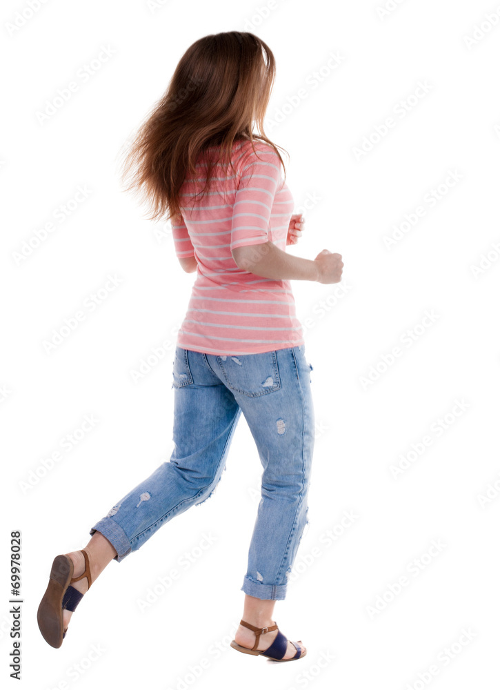 back view of running woman. beautiful redhead girl in motion. Stock ...