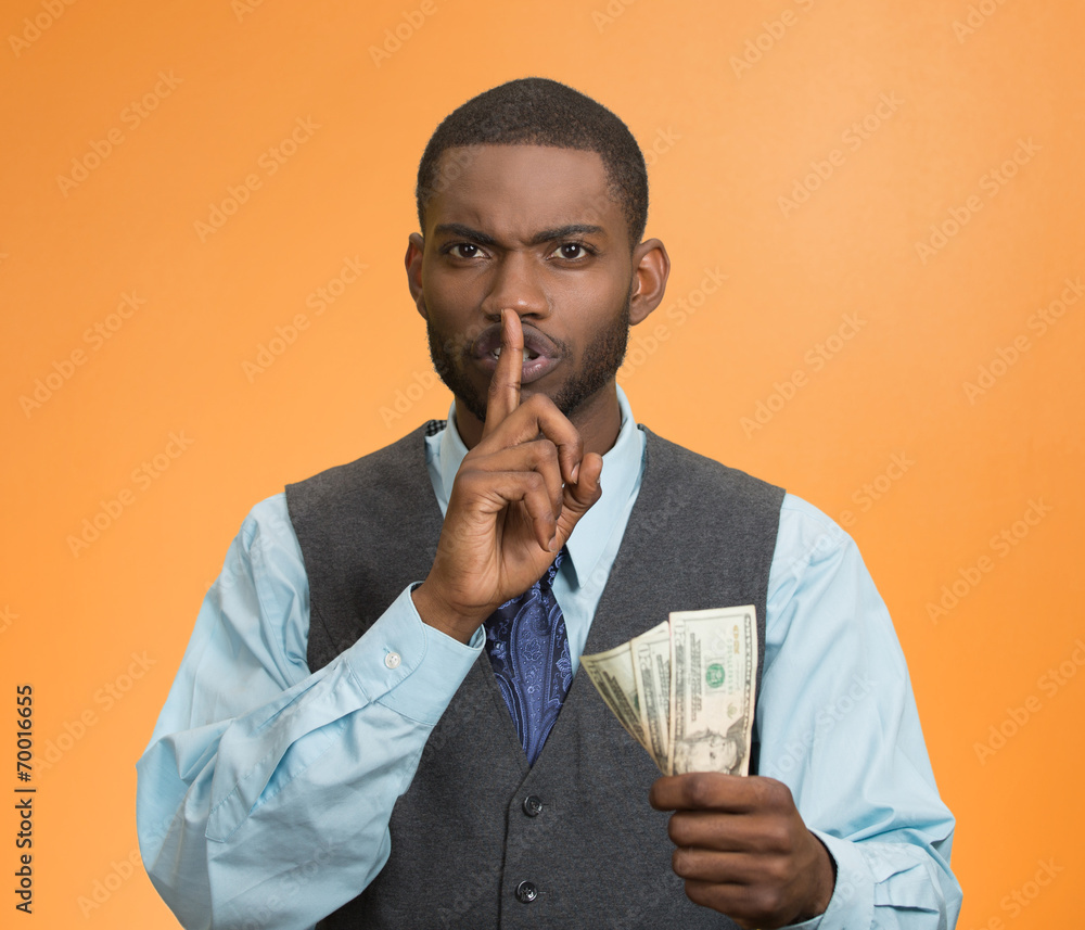 Corrupt businessman holding dollar bills showing shhh sign Stock Photo ...