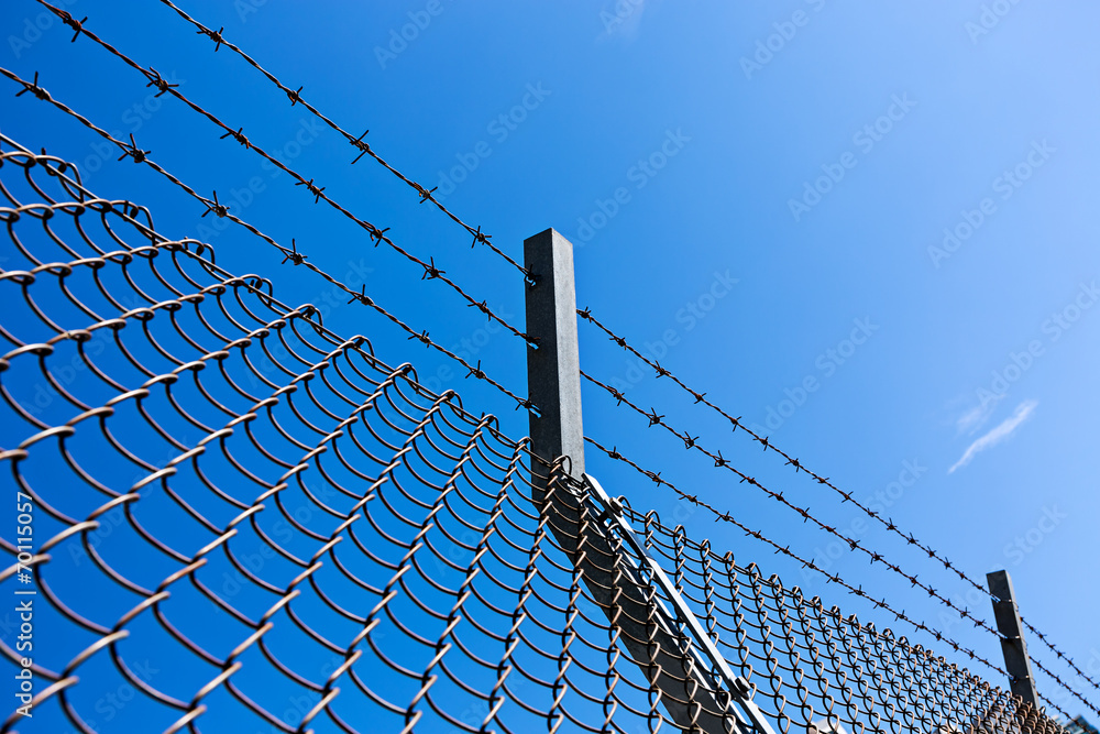 Razor Wire Above a Fence Stock Photo | Adobe Stock