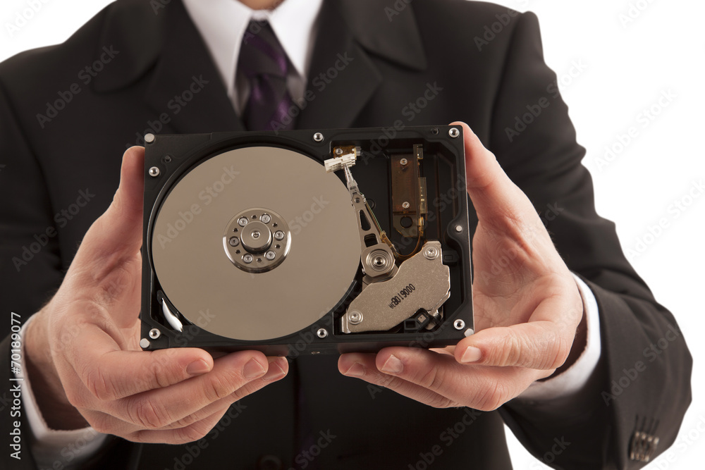 Businessman showing hard drive Stock Photo | Adobe Stock