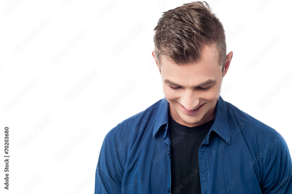 Handsome young man looking down Stock Photo | Adobe Stock Handsome young man looking down Stock Photo | Adobe Stock