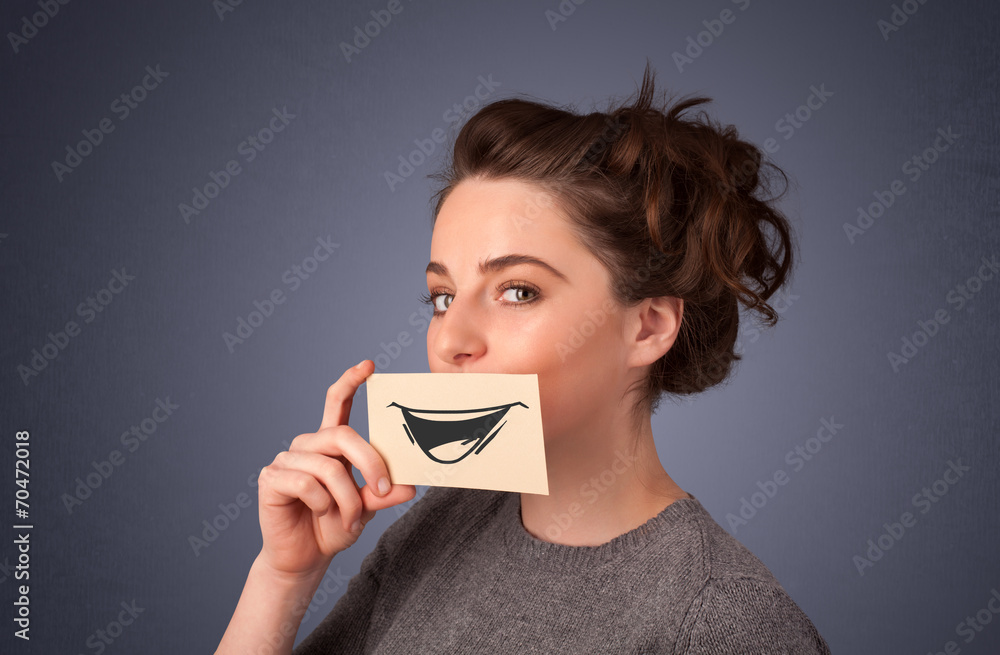 Happy cute girl holding paper with funny smiley drawing Stock Photo ...