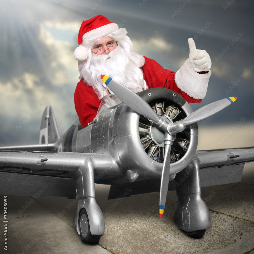 Santa Claus with his cargo plane. Stock Photo | Adobe Stock
