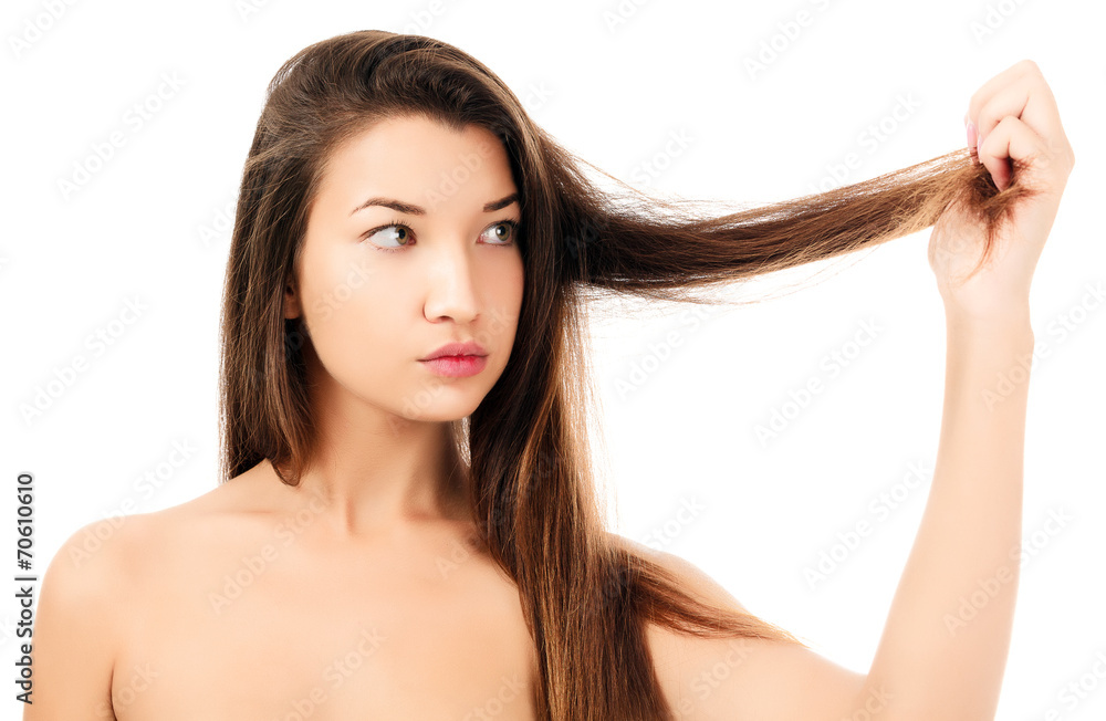 woman looking on her fragile hair, white background, copyspace Stock ...