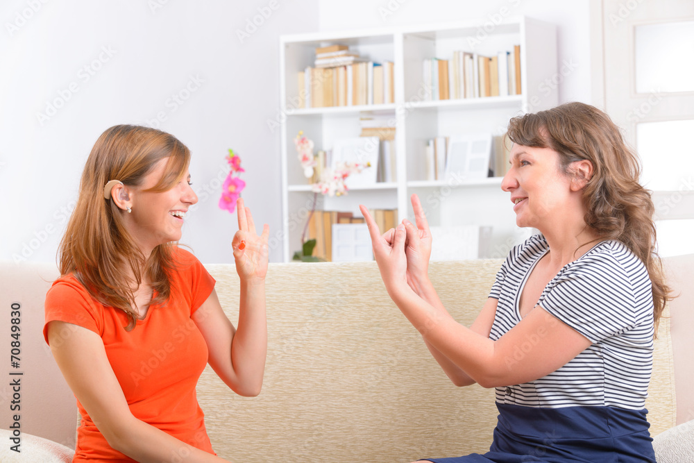 Deaf woman learning sign language Stock Photo | Adobe Stock