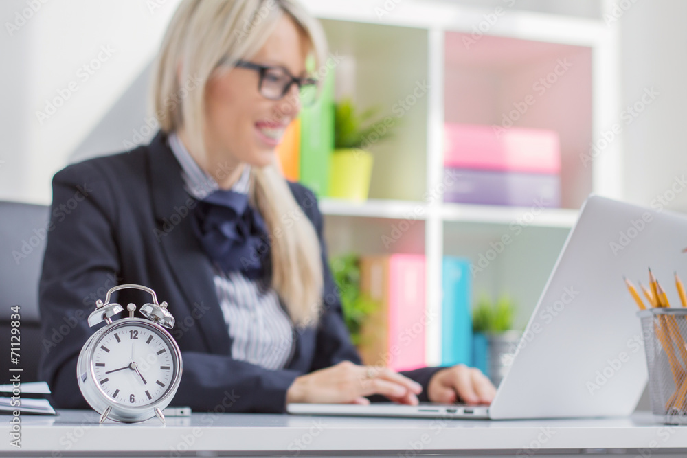 Hard working woman is always on time at work Stock Photo | Adobe Stock